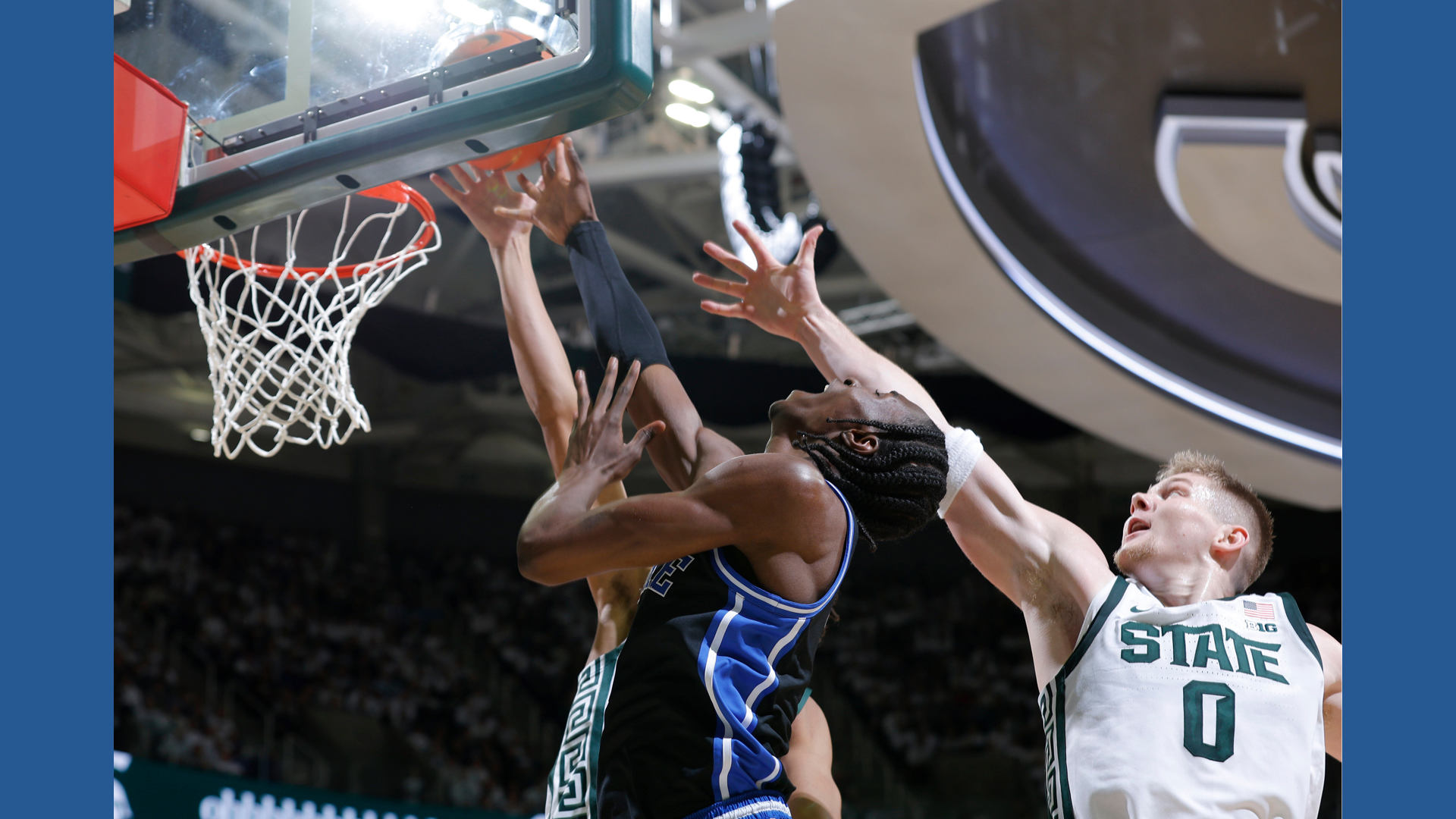 Cameron Boozer scores 18 in No. 4 Duke's 66-60 win over No. 7 Michigan ...