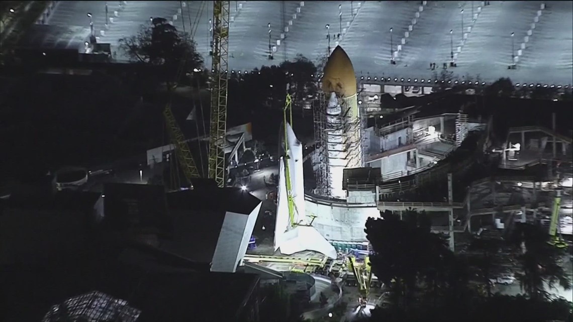 Space Shuttle Endeavour hoisted for installation in vertical display at ...