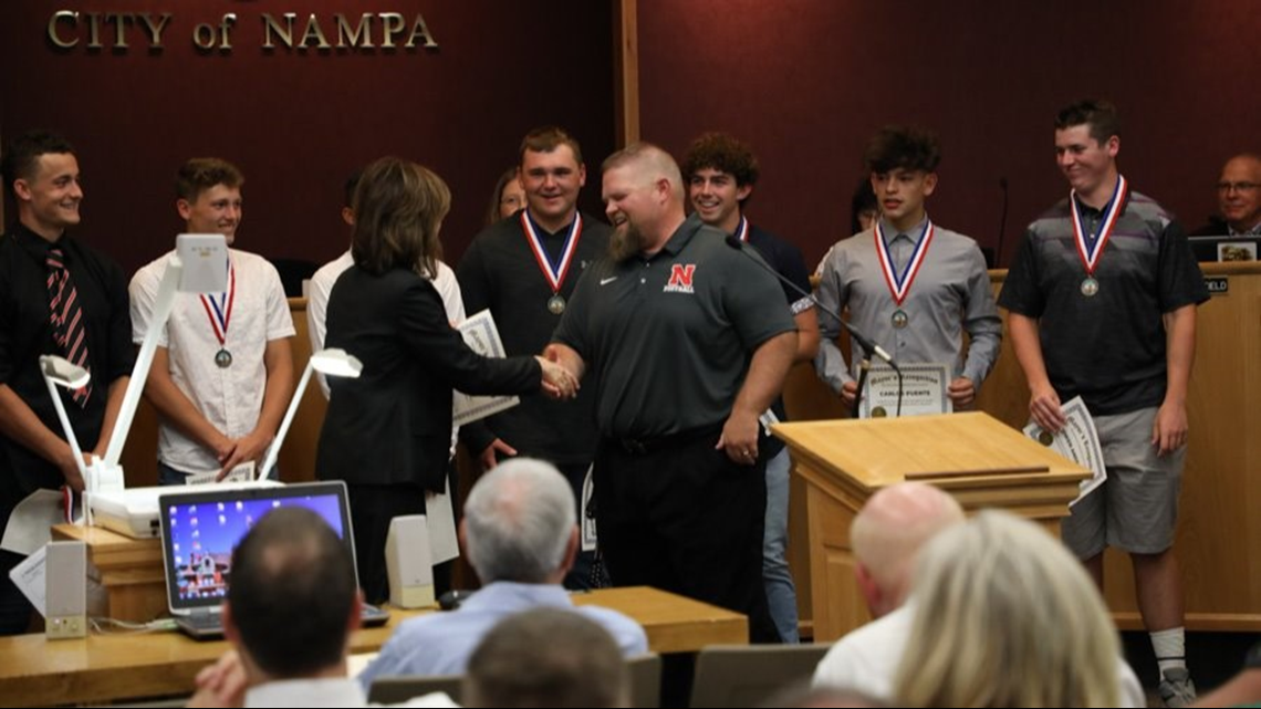 Nampa football players, coach honored after surprising boy at his ...