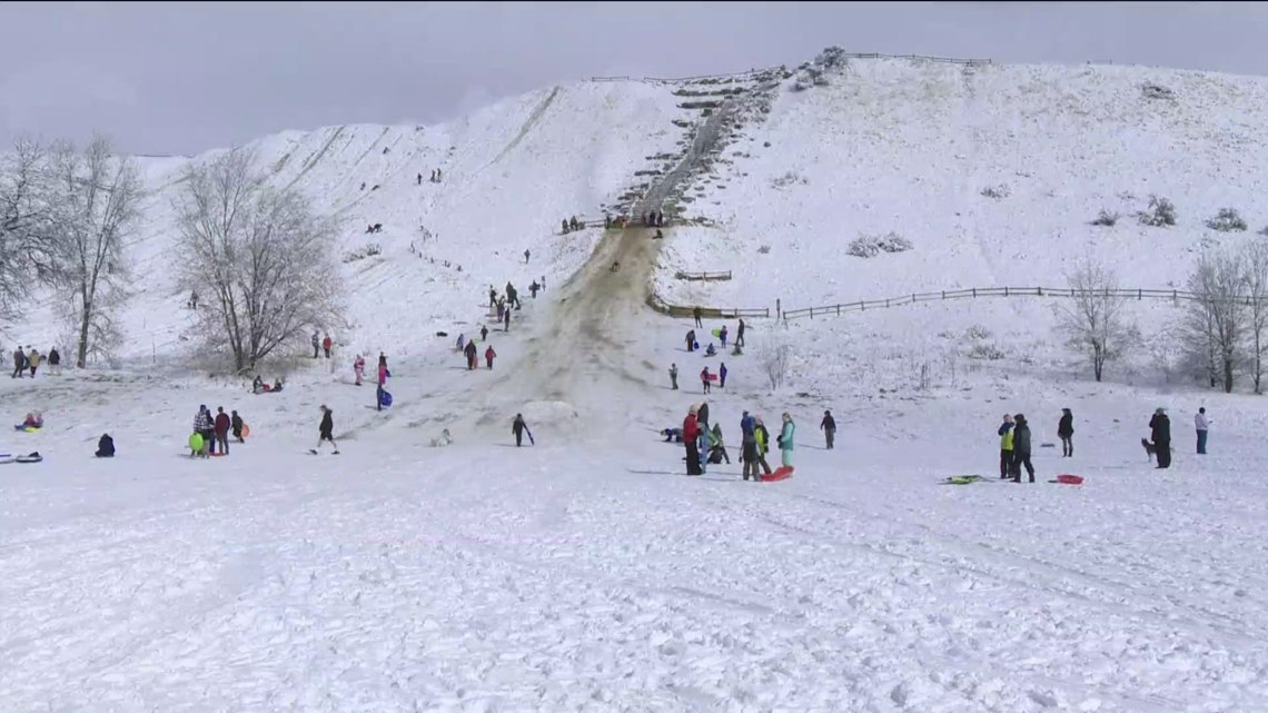 Families hit the snow-covered hill at Camel's Back Park in Boise | ktvb.com